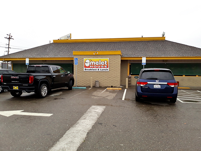 The unassuming yellow-trimmed exterior of The Omelet House might not scream "breakfast paradise," but locals know better than to judge this egg sanctuary by its shell.