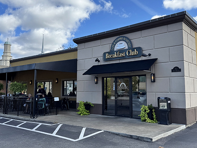 The Breakfast Club's welcoming façade stands like a beacon for morning food pilgrims, with its classic black awning promising comfort inside.