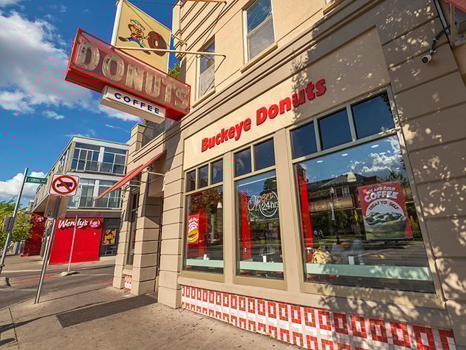 The iconic Buckeye Donuts storefront stands proudly on High Street, its vintage neon sign a beacon of hope for the hungry at any hour.