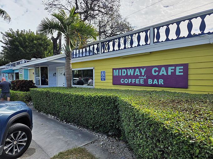 The sunshine-yellow exterior with its purple sign isn't just eye-catching&mdash;it's practically screaming "vacation mode activated" to everyone driving by.