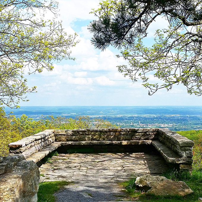Nature's infinity pool! This stone overlook at Gambrill State Park frames the Frederick Valley like a masterpiece, no Instagram filter required.