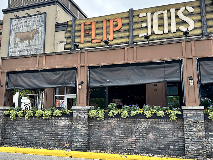The rustic-industrial facade of Flip Side beckons hungry travelers with its bold signage and inviting brick patio&mdash;a carnivore's lighthouse in Easton's retail sea.