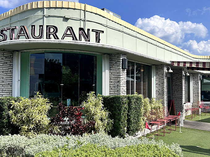 The mid-century modern fa&ccedil;ade of Howley's stands as a time capsule of Florida cool, complete with lush landscaping that says "come in, relax, you've found your happy place." 