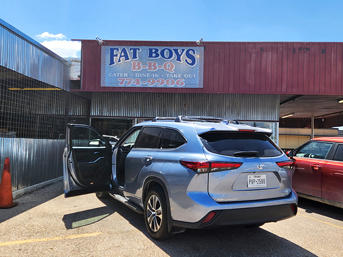 The unassuming red exterior of Fat Boy's BBQ stands like a smoke signal to hungry travelers. Texas wisdom: the plainer the building, the better the barbecue inside.