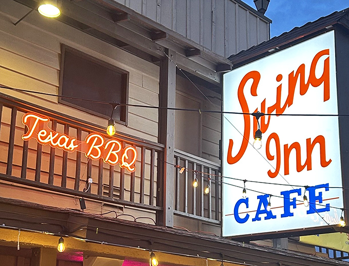 The iconic Swing Inn beckons with its cheerful red umbrellas and rustic charm, a Temecula treasure hiding in plain sight.