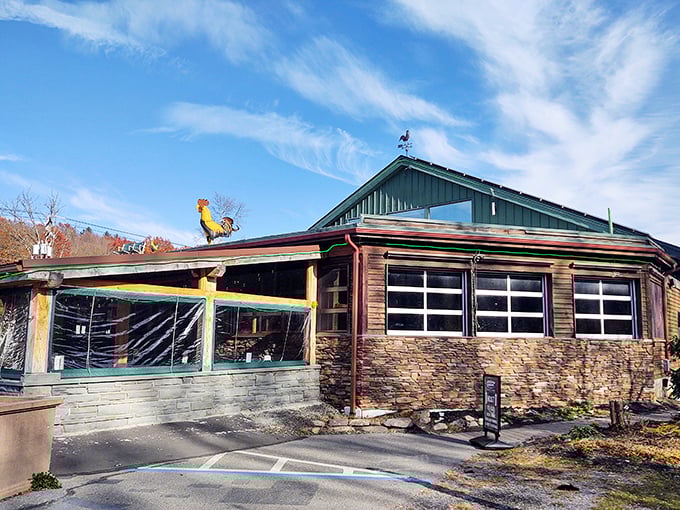 The rustic charm of Barley Creek's exterior, complete with that whimsical rooster weathervane, promises Pocono Mountain magic before you even step inside.
