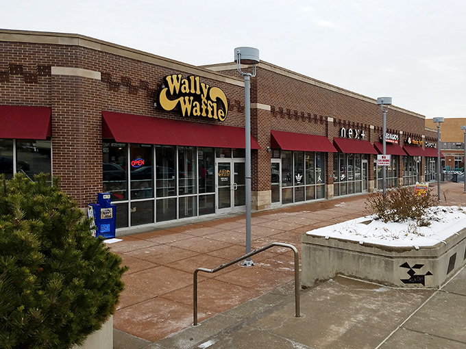 The brick exterior promises comfort food greatness, and those red awnings practically wave you in like old friends.