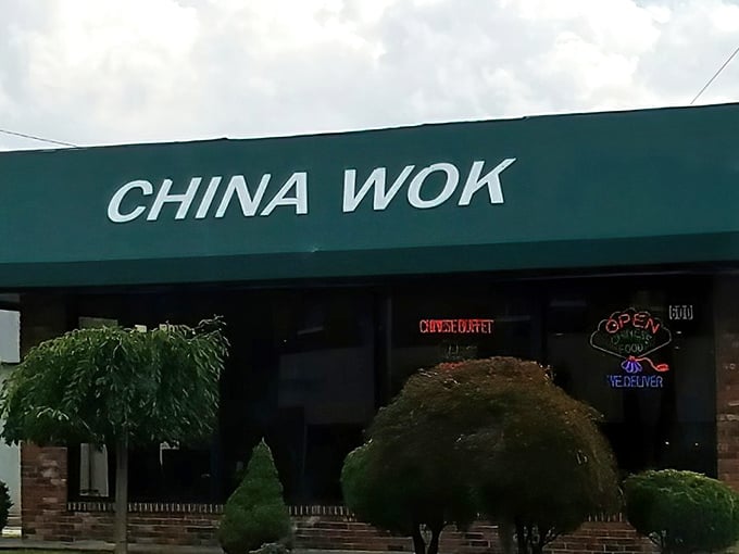 The modest green awning and brick facade hide culinary treasures within, like finding a diamond in your fortune cookie.