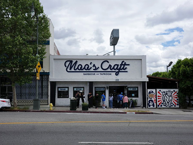 The white facade of Moo's Craft Barbecue stands like a beacon of hope for meat lovers in a city better known for juice cleanses than brisket.