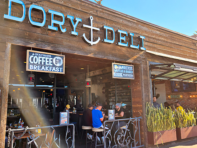 The weathered wood facade and bright blue lettering of Dory Deli beckons like an old friend with a new story to tell.