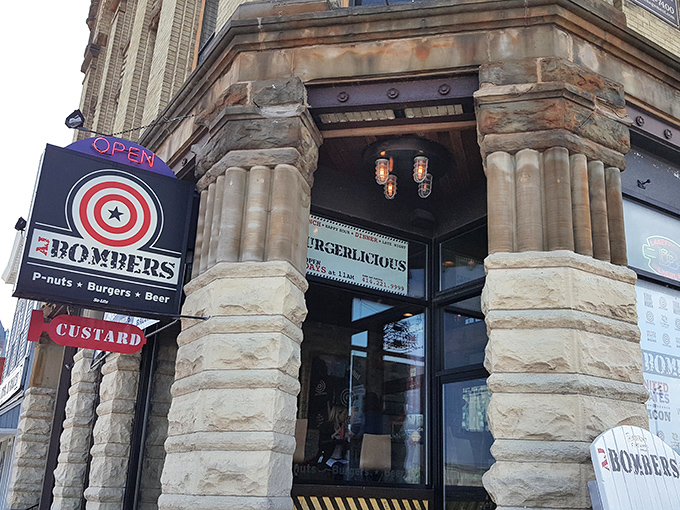 The historic facade of AJ Bombers stands as Milwaukee's answer to the age-old question: "Where can I find peanuts, burgers, and beer in one perfect trifecta?"