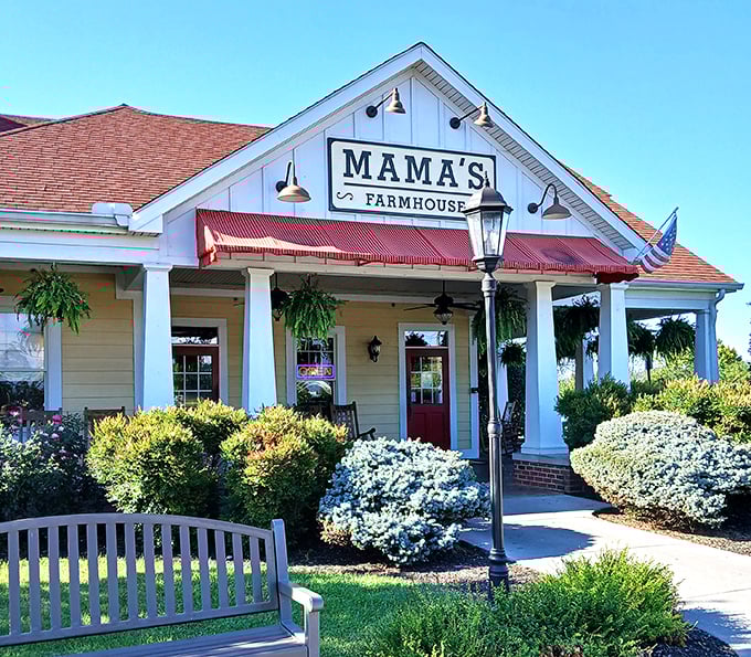 The classic white farmhouse exterior with its red-trimmed awning isn't just inviting&mdash;it's practically hollering "Come get some comfort food, y'all!"