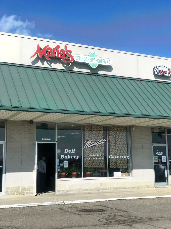 The unassuming exterior of Maria's Italian Bakery in Novi hides culinary treasures that would make any nonna proud. Green awning, red sign, pure magic inside.
