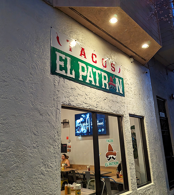 The unassuming storefront of Tacos El Patron beckons with its sign and iconic sombrero logo&mdash;proof that culinary treasures often hide in plain sight.