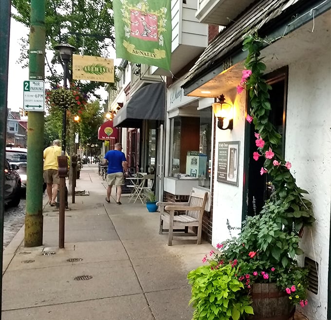The charming streetscape of Chestnut Hill welcomes you with flowering planters and neighborhood warmth that feels like home.