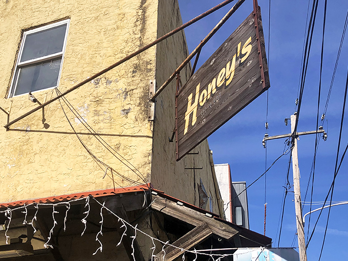 That weathered wooden sign against the yellow building isn't just decoration&mdash;it's a beacon for breakfast pilgrims seeking Philadelphia's comfort food promised land.