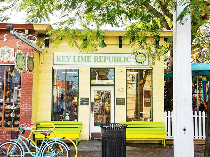 The cheerful yellow facade of Key Lime Republic welcomes visitors with bright green benches that practically scream "sit here after pie consumption!"