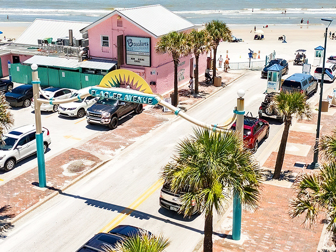 The iconic Flagler Avenue arch welcomes you to paradise, where Breakers Restaurant stands ready to satisfy post-beach cravings just steps from the Atlantic.