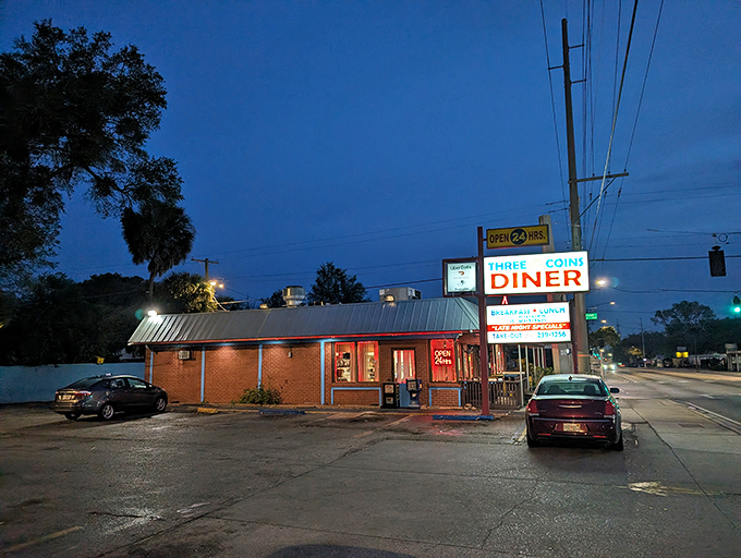 The pink-trimmed facade of Three Coins Diner stands like a time capsule on Tampa's Nebraska Avenue, complete with decorative coins that inspired its name. 