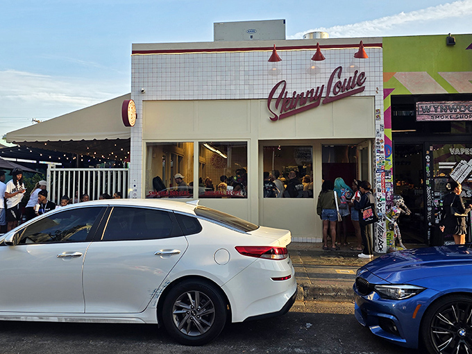 The unassuming white-tiled exterior of Skinny Louie belies the culinary magic happening inside. Miami's best-kept burger secret hides in plain sight.