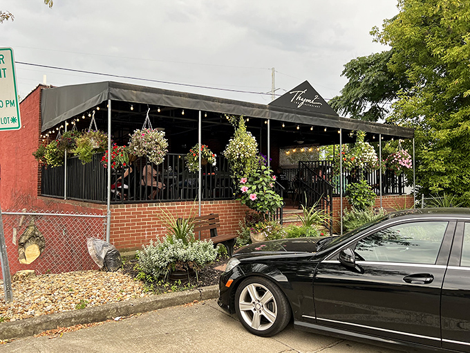 Thyme2's inviting exterior welcomes you with colorful hanging flower baskets and a covered patio&mdash;like a culinary hug before you even step inside.