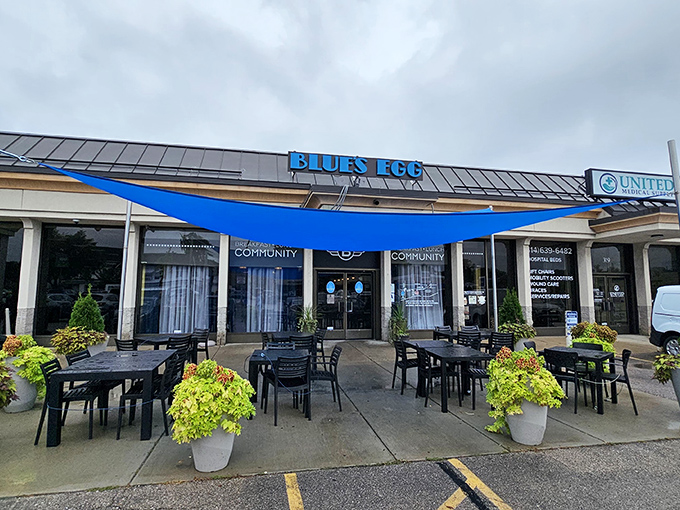 The blue sign beckons like a breakfast lighthouse, guiding hungry souls to this Milwaukee temple of morning delights. No passport required for this culinary journey.