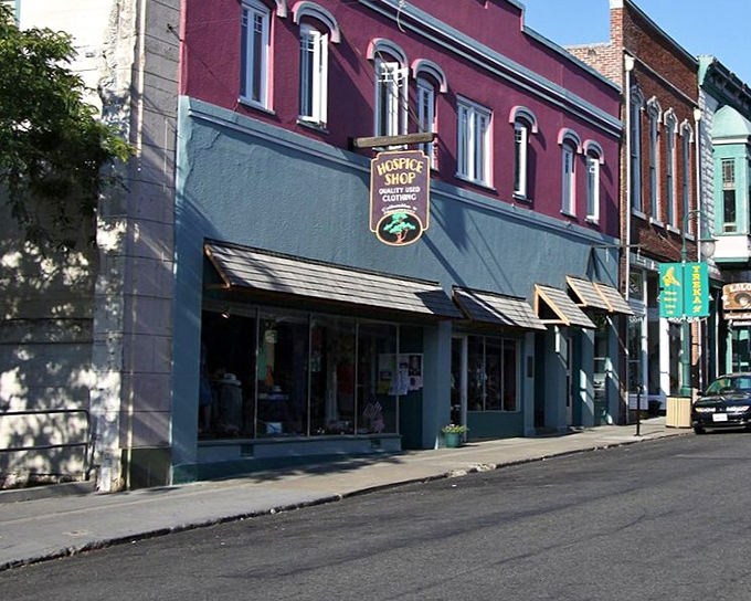 Miner Street stretches into the distance, framed by colorful historic buildings and mountain views. Small-town charm doesn't get more picture-perfect than this.