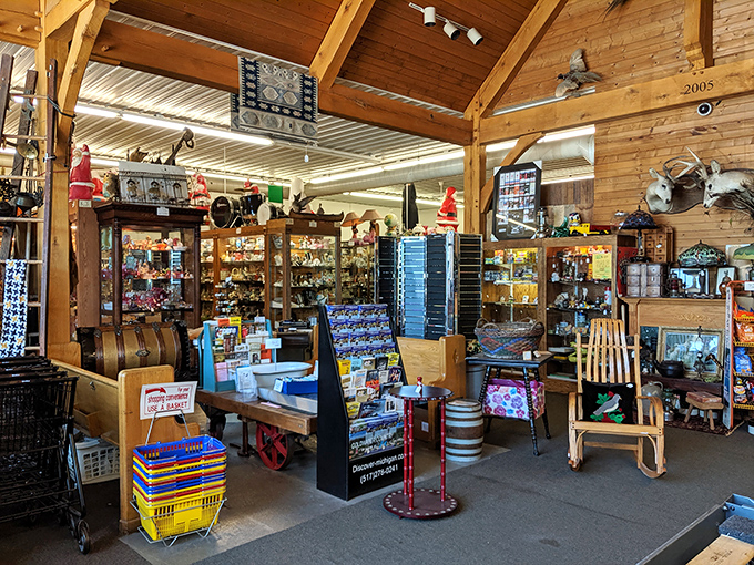 The warm wooden interior of Hog Creek Antique Mall beckons treasure hunters with its labyrinth of vendor booths&mdash;a paradise where history whispers from every shelf.