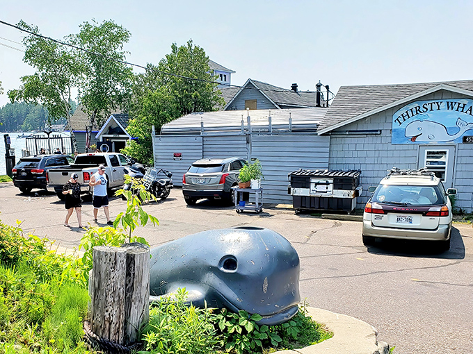 The blue whale sculpture greets hungry visitors like a quirky guardian of deliciousness, hinting at the nautical treasures that await inside this lakeside gem.