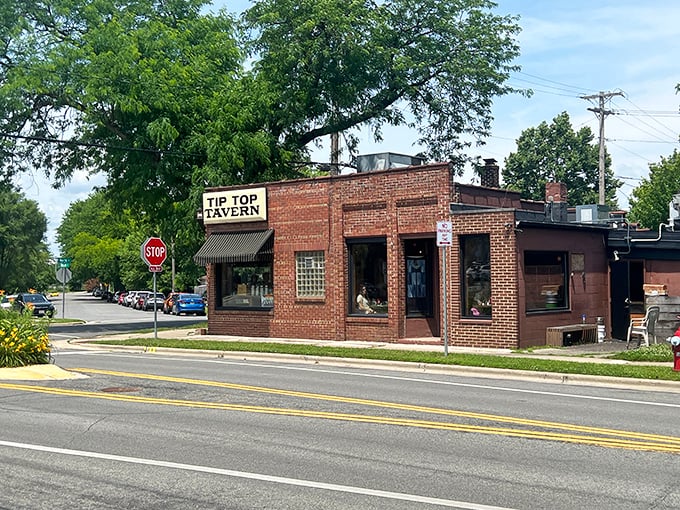 The unassuming brick exterior of Tip Top Tavern stands like a culinary sentinel at the corner, promising delights that belie its modest appearance.
