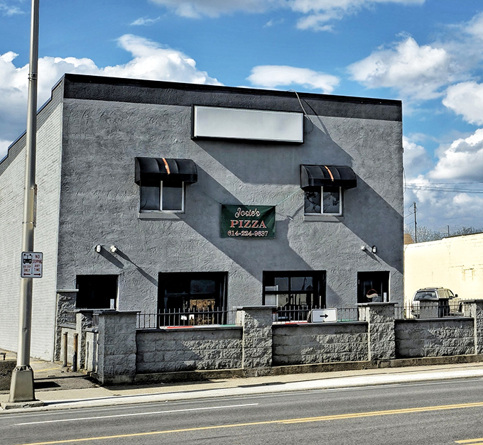 The gray fortress of flavor on West Broad Street stands proud with American flags and those inviting red umbrellas beckoning pizza pilgrims inside.