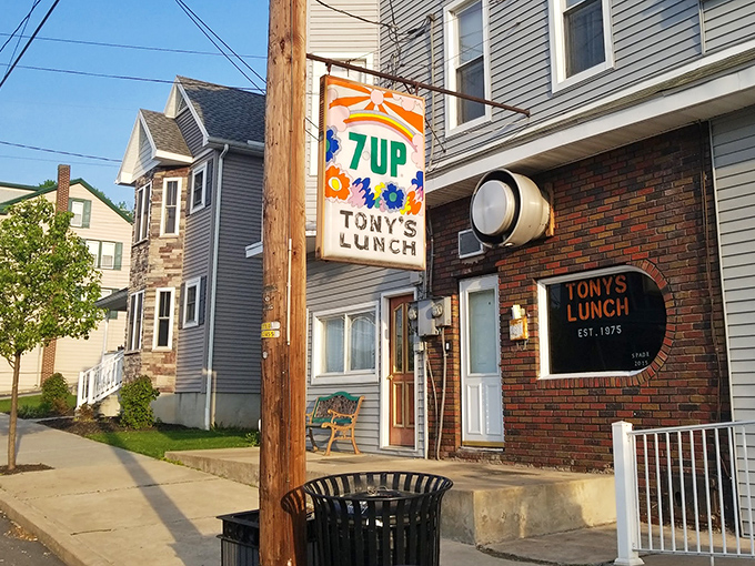 The vintage 7UP sign beckons like a neon lighthouse, guiding hungry travelers to Tony's Lunch in Girardville. Some landmarks need no explanation. 