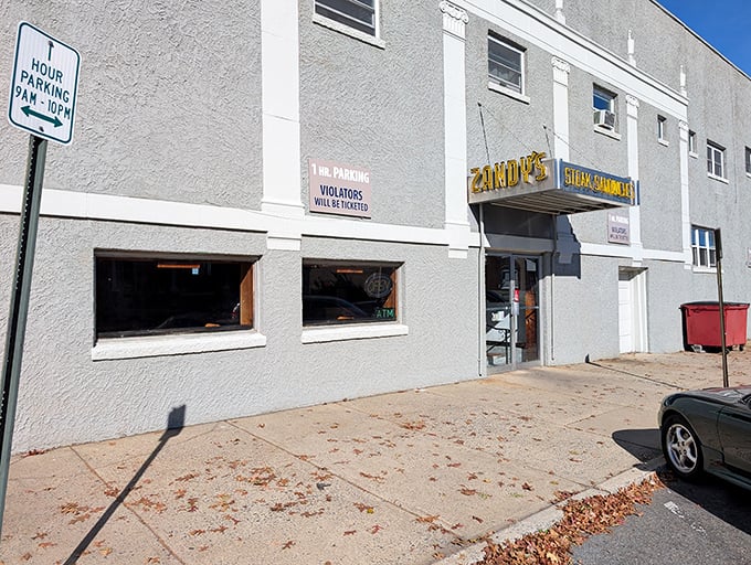 The unassuming gray exterior of Zandy's Steak Shop stands like a culinary fortress, promising treasures within that no flashy facade could ever match.