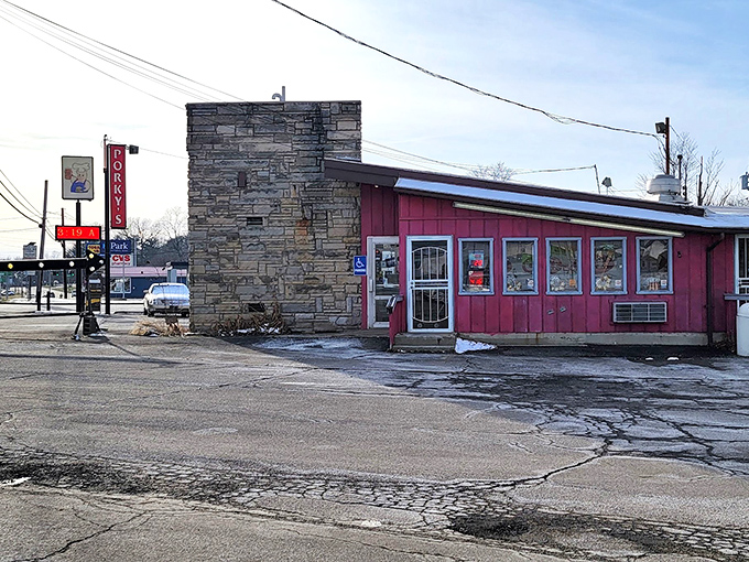 The unassuming pink exterior of Porky's Drive In stands as a time capsule of Americana, where culinary memories have been made since long before "retro" became trendy. 