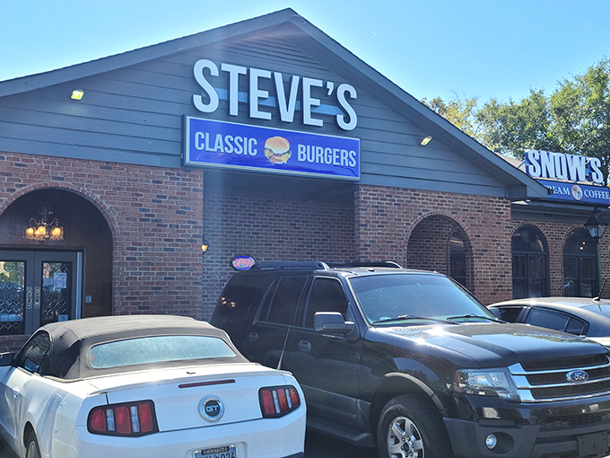 Steve's Classic Burgers stands proudly in its brick-faced glory, like that reliable friend who's always there when hunger strikes. The neighboring Snow's Ice Cream promises a sweet finale.