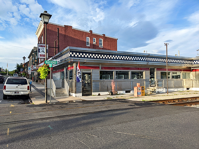 The classic stainless steel exterior of Lincoln Diner gleams in the sunlight, a time capsule of Americana where breakfast dreams come true.