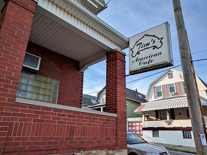 The unassuming red brick exterior of Tim's American Cafe stands like a culinary sentinel in Altoona, promising homestyle delights behind its modest facade.