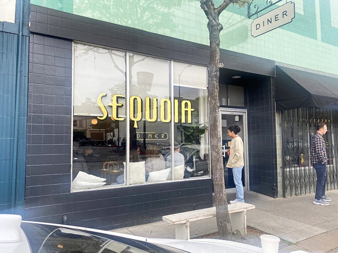 A simple sign reading "DINER" against turquoise tiles tells you everything you need to know&mdash;culinary treasures often hide behind the most unassuming facades.