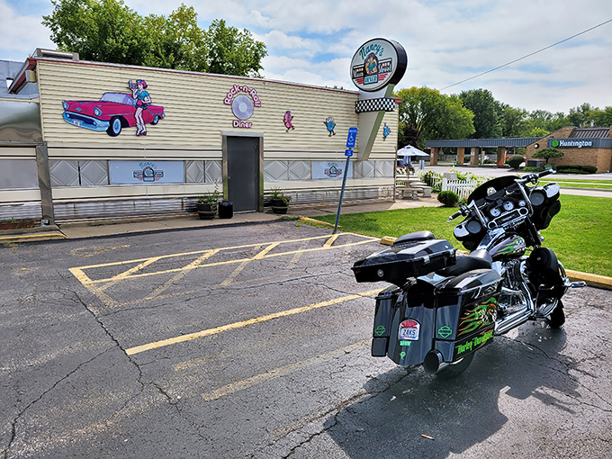 The classic stainless steel exterior of Nancy's Main Street Diner gleams in the sunlight, a time capsule of Americana waiting to feed hungry souls. 