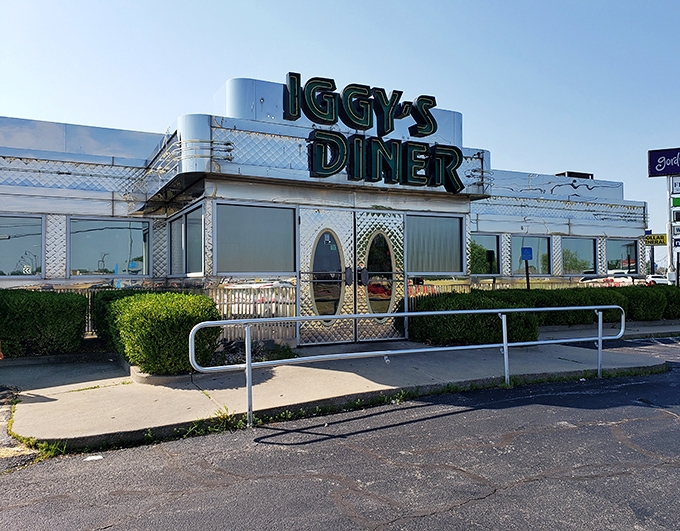 The gleaming silver exterior of Iggy's Diner beckons from Route 66 like a time machine disguised as a lunch counter. Pure Americana awaits.