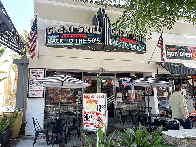 The iconic fa&ccedil;ade of The Great Grill beckons with its neon promise of time travel. American flags flutter alongside a menu that makes decisions deliciously difficult.