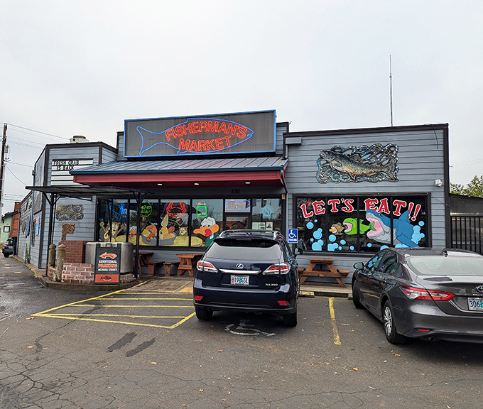 The neon glow of Fisherman's Market beckons like a lighthouse for hungry souls. Those picnic tables outside aren't just seating&mdash;they're stages for impending seafood euphoria.