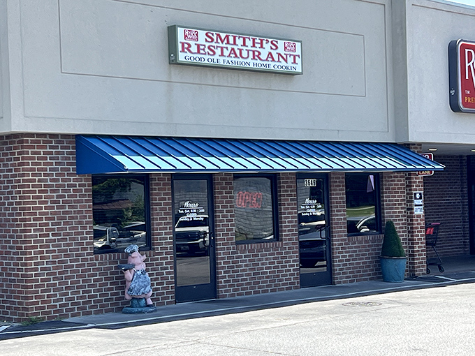 The unassuming brick fa&ccedil;ade with its bright blue awning promises no frills, just honest-to-goodness Southern cooking that's worth every calorie.