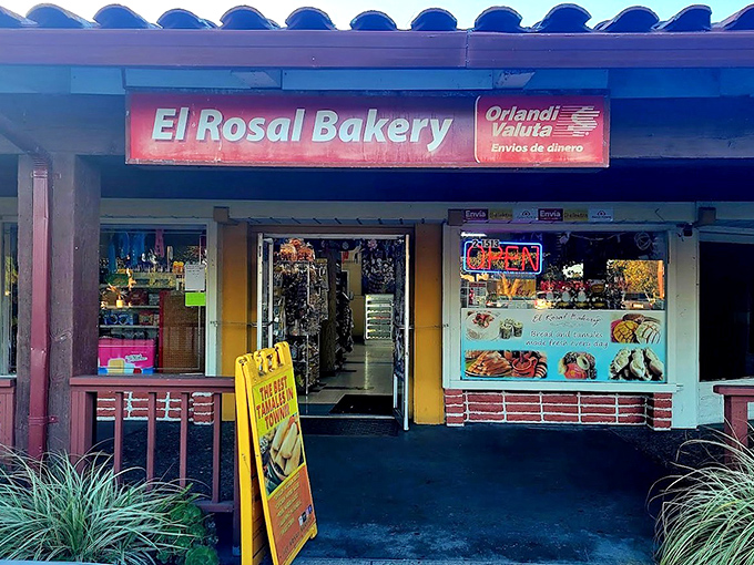 The unassuming storefront of El Rosal Bakery beckons with its blue-tiled roof and bright red sign&mdash;proof that culinary treasures often hide in plain sight.