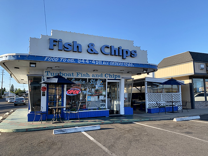 The nautical-themed fa&ccedil;ade of Tugboat Fish & Chips stands proud along Fair Oaks Boulevard, a blue and white beacon for seafood lovers seeking their next maritime feast.