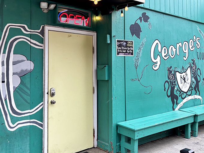 The unmistakable green facade of George's Lounge stands out on Cleveland Avenue like a culinary lighthouse guiding hungry travelers to burger paradise.