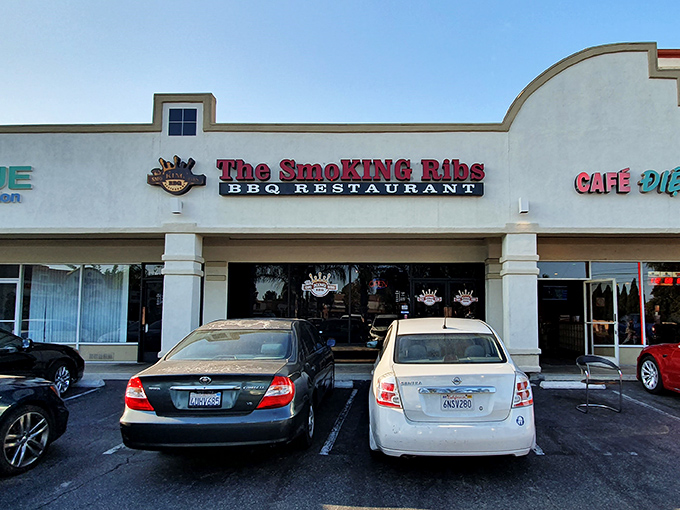 The unassuming storefront belies the smoky treasures within. Like finding a diamond in a strip mall, The Smoking Ribs' exterior promises authentic BBQ without pretension.