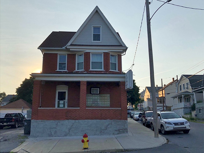 The unassuming red brick exterior of Tim's American Cafe stands like a culinary sentinel in Altoona, promising homestyle delights behind its modest facade.