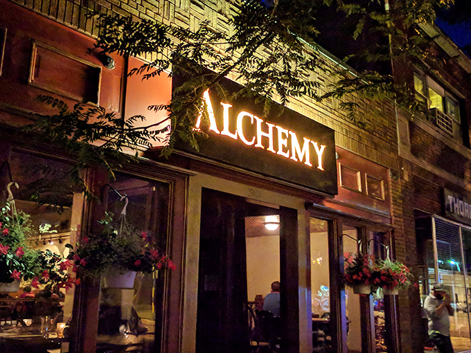 The weathered brick and golden "ALCHEMY" sign aren't just a storefront—they're a promise of culinary magic waiting inside this Madison gem.