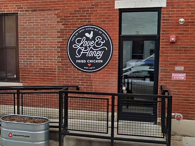 The unassuming brick facade of Love & Honey Fried Chicken in Northern Liberties hides culinary greatness behind that elegant black sign.